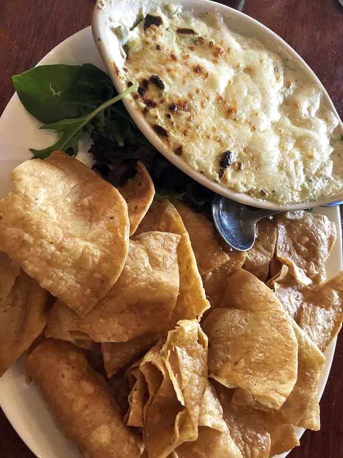 Warm, bubbly artichoke dip surrounded by crispy chips is the kind of starter that disappears fast.