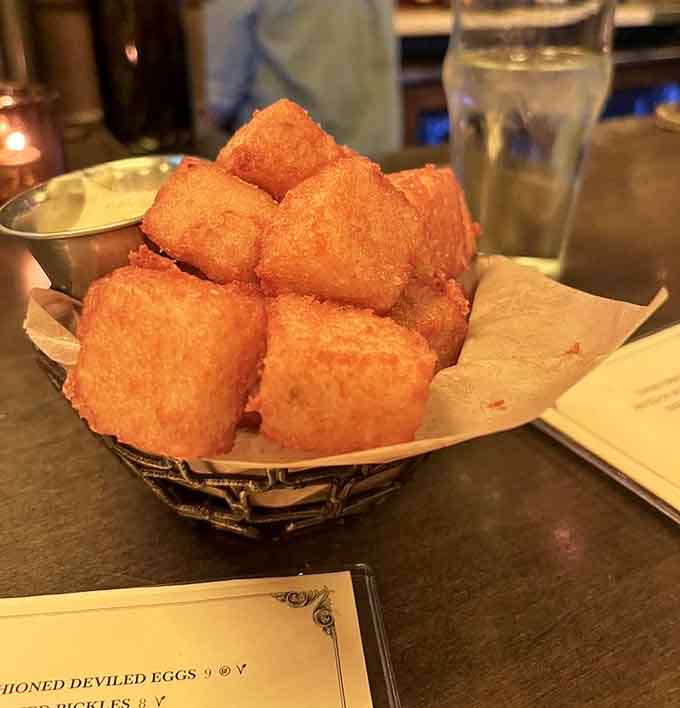 These aren't your freezer aisle tater tots; they're golden, crispy perfection served with dipping sauces worth writing home about.