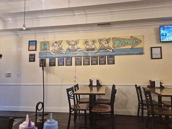 Whimsical pig artwork adds personality to the space, reminding diners to embrace the joyful side of eating.