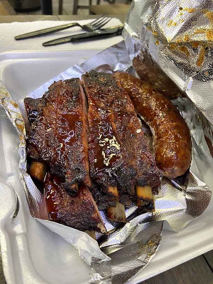 Ribs glistening with sauce, cooked to that perfect pull-off-the-bone consistency that separates champions from pretenders everywhere.