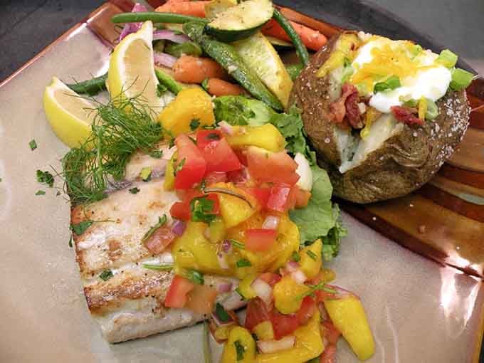 Mahi mahi gets the gourmet treatment with mango salsa, proving that ranch country knows its way around seafood too.