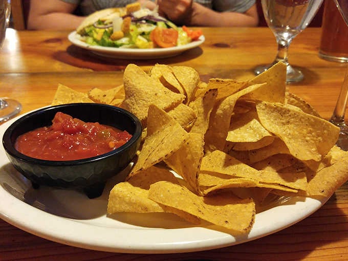 Fresh tortilla chips and salsa prove that even the appetizers here understand the assignment perfectly.