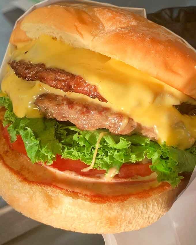 Fresh lettuce, ripe tomato, and a perfectly cooked patty create burger harmony worth singing about.