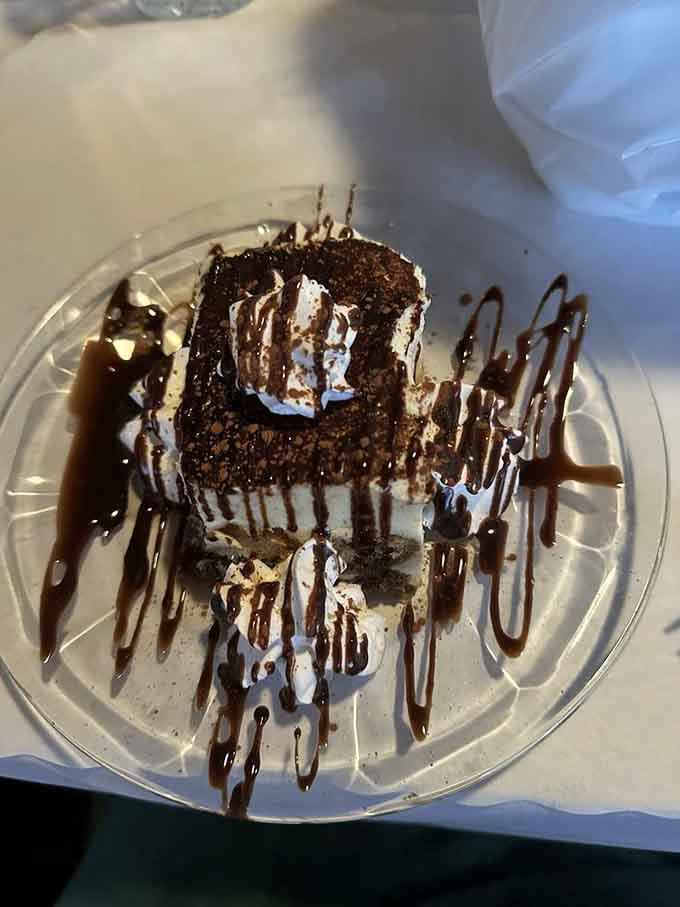 Tiramisu drizzled with chocolate sauce and topped with whipped cream&mdash;because you absolutely found room for dessert.