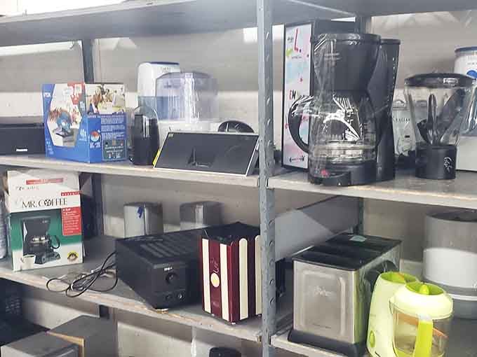 Electronics from various eras coexist peacefully on shelves, like a technology museum you can actually afford to shop.