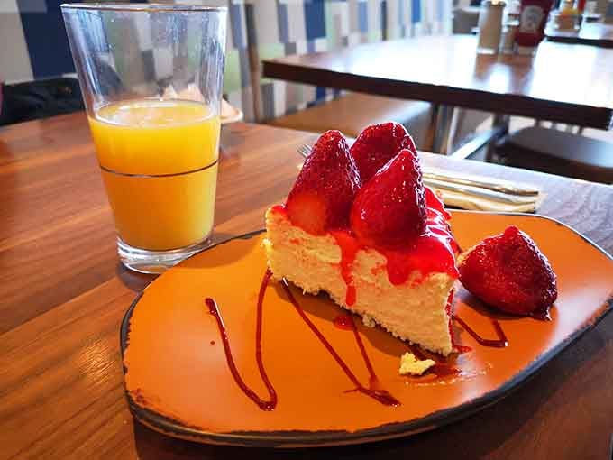 Cheesecake crowned with fresh strawberries that looks almost too beautiful to eat, but you absolutely will anyway.