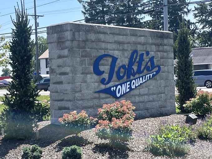 The stone monument outside declares "One Quality" like a delicious mission statement you can actually taste and believe.