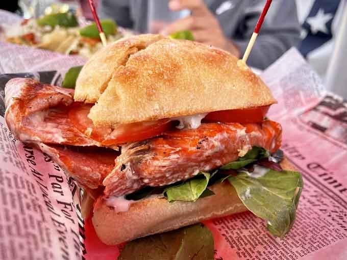 A grilled salmon sandwich so good it'll make you question every landlocked dining decision you've ever made.