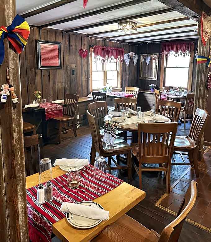 Rustic wooden tables dressed in traditional linens set the stage for an authentic dining experience worth savoring slowly.