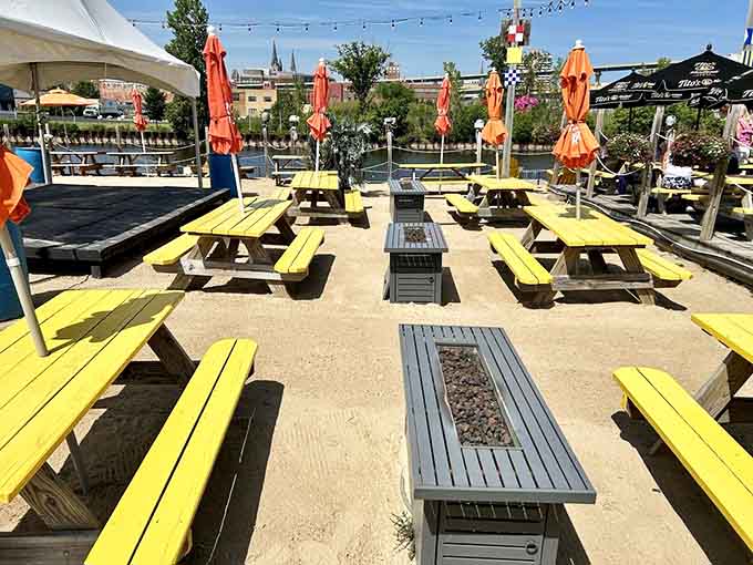 Fire pits between yellow tables mean the party continues even when Wisconsin weather gets its usual ideas.