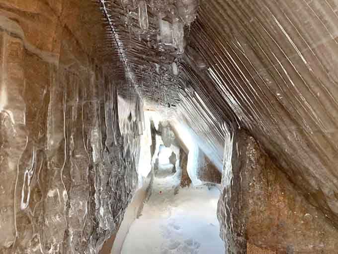 Ice formations inside create a natural cathedral, where icicles hang like chandeliers in an abandoned ballroom.