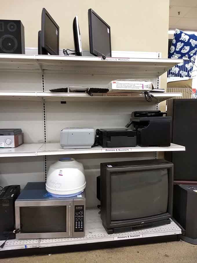 Electronics from various decades coexist peacefully, from vintage TVs to modern printers seeking second chances.