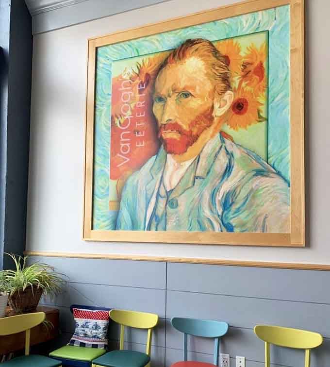 The master himself watches over diners, surrounded by his famous sunflowers, because ambiance matters when you're serving authentic Dutch cuisine.