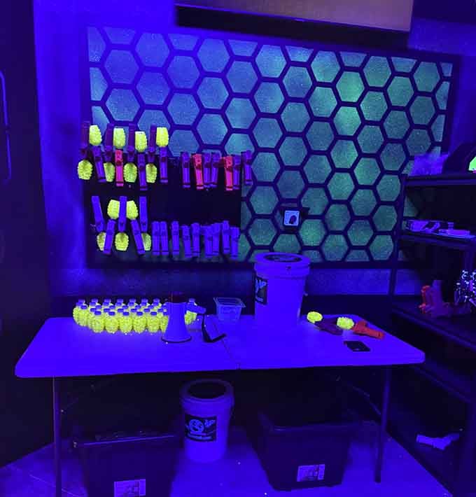 Gellyball equipment glows under UV light, transforming tactical combat into something straight out of a neon fever dream.