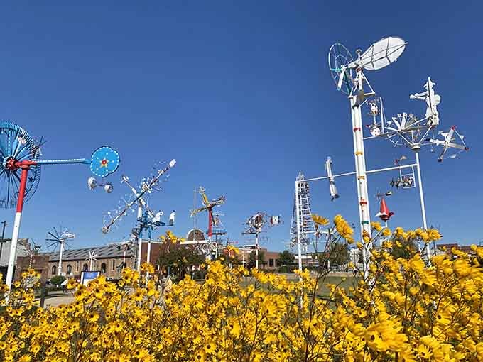 Spring blooms frame these mechanical marvels, proving nature and human creativity make surprisingly excellent neighbors after all.