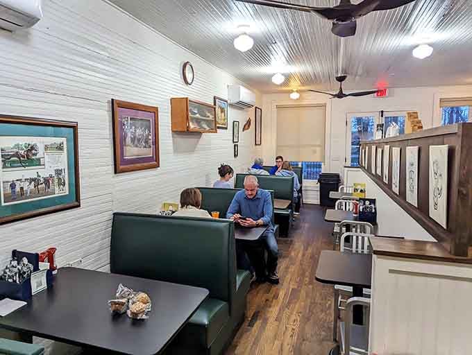 Green booths, white walls, and framed horse photos create the perfect backdrop for your upcoming sandwich love affair.