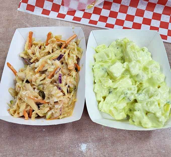 Classic deli sides done right: creamy coleslaw and potato salad that complement any sandwich you choose at Weinberger's.