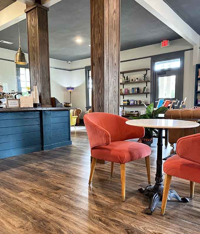 Coral-colored chairs at marble tables where wine and conversation flow as freely as the book recommendations.