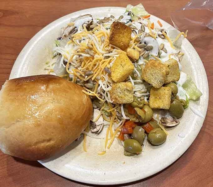 A fresh salad loaded with toppings shows the buffet offers quality beyond the main attractions.