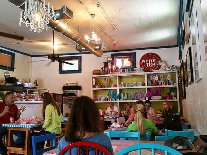 Colorful chairs and happy diners create the kind of atmosphere where good food meets genuine community vibes.