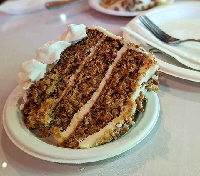 Towering hummingbird cake layers that look like they were assembled by someone who believes more is always better.