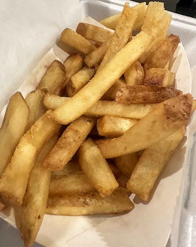 Hand-cut fries with that golden exterior are the supporting actor that never upstages but always delivers the goods.