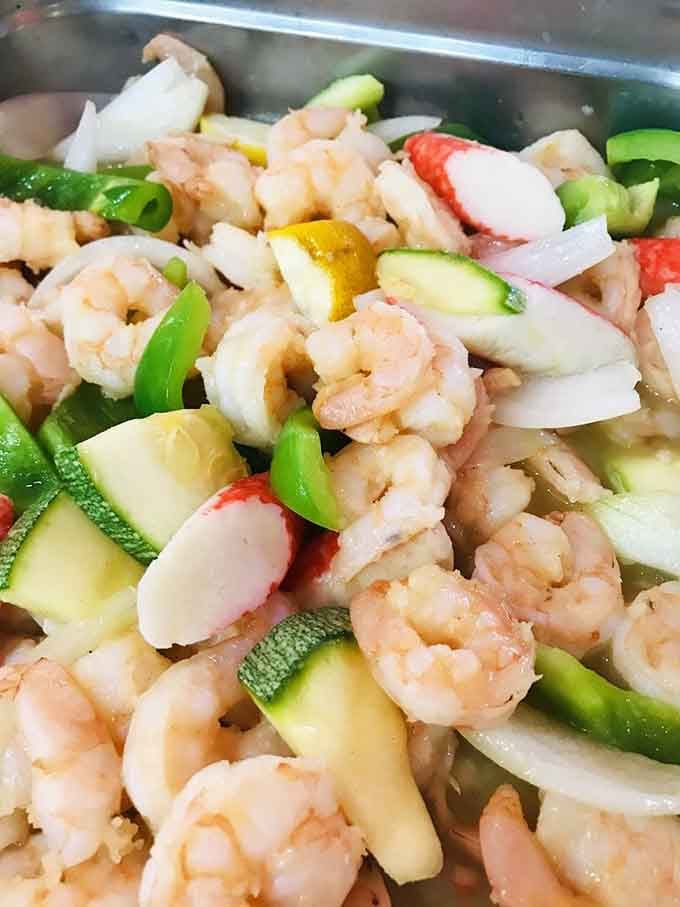 Shrimp, crab, and fresh vegetables combine in a colorful medley that screams "I'm getting my money's worth!"