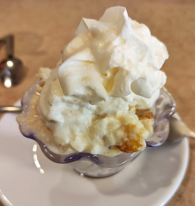 Banana pudding crowned with whipped cream because sometimes more is exactly what you need right now.