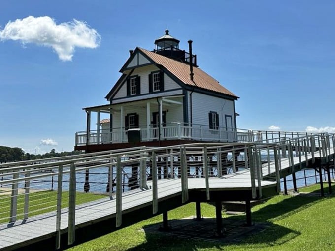 Standing gracefully on its pier like a Victorian lady in her finest dress, complete with wraparound porches and gingerbread trim.