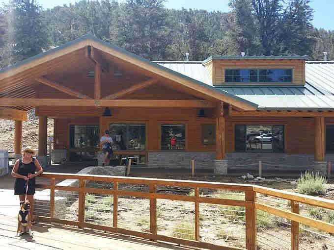 Modern mountain lodge meets rustic charm at this welcoming visitor center surrounded by ancient natural wonders.
