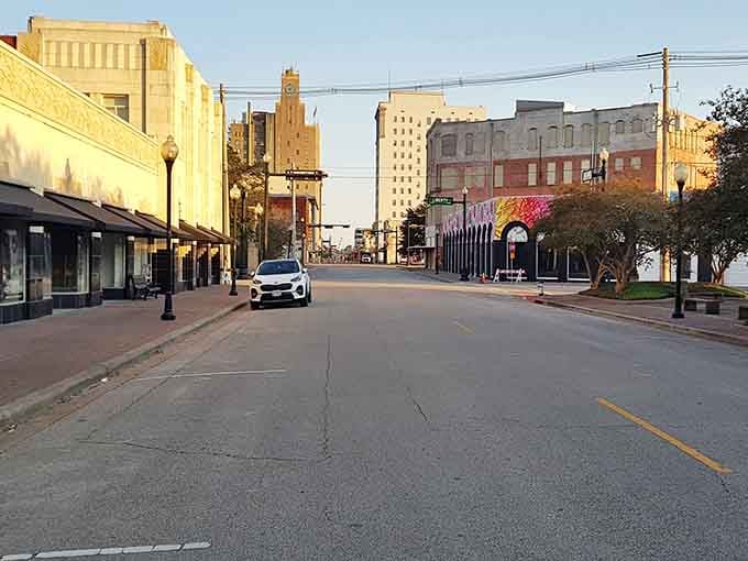 Historic buildings catch the late afternoon glow downtown, where wide streets and vintage architecture create a scene that feels timeless and welcoming.