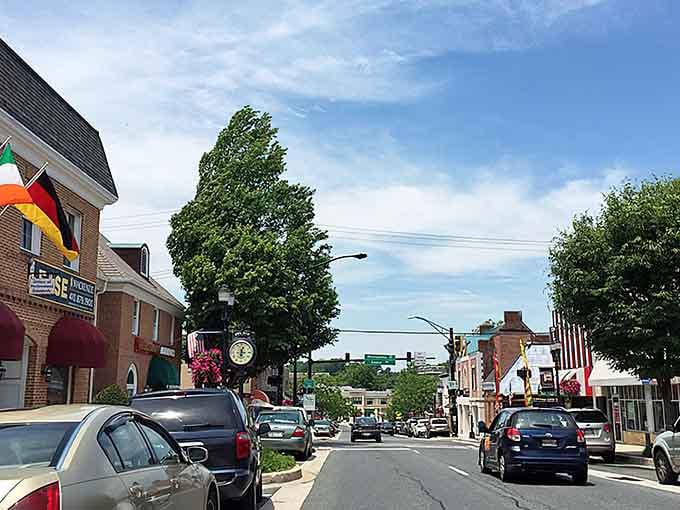 Tree-lined streets and hanging flower baskets show a town that takes pride in every detail.