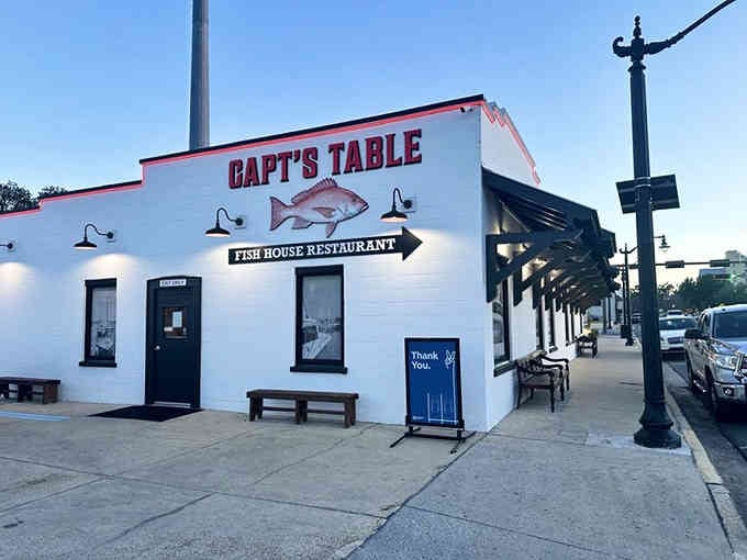 The simple white exterior with that red snapper sign tells you everything you need to know about priorities.