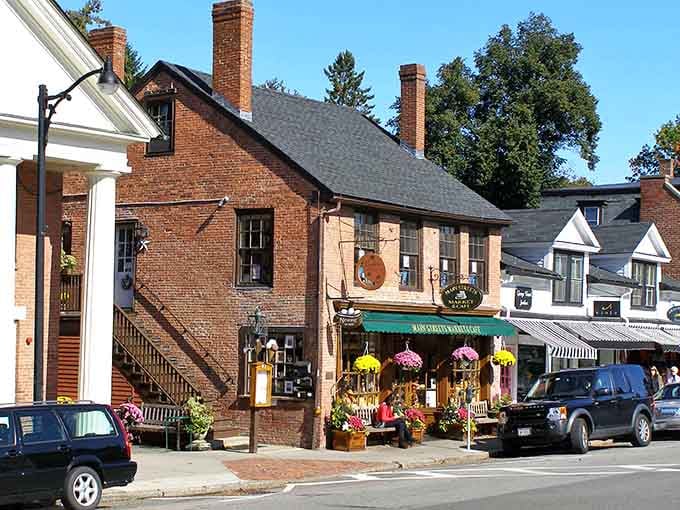 Concord's timeless main street: where colonial brick buildings, cheerful flower displays, and small-town hospitality create magic.