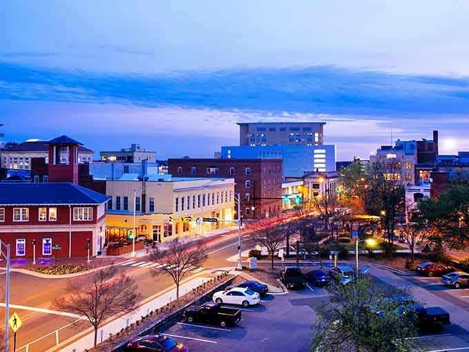 Blue hour transforms downtown into a glowing wonderland where streetlights twinkle and buildings shimmer like a holiday card come alive.