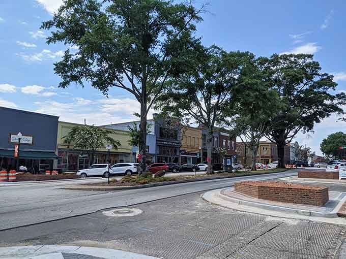 Towering oaks create a natural canopy over downtown streets, offering shade that's been free for generations.