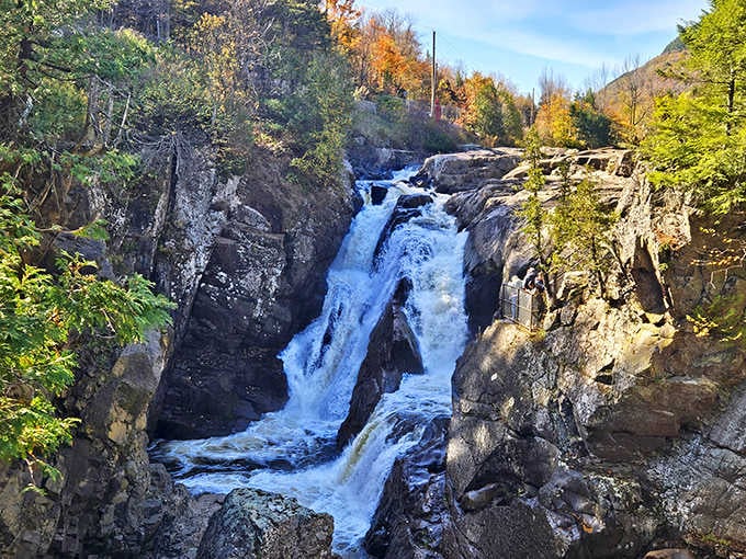 Autumn colors explode around the rushing rapids, proving that fall in the Adirondacks is worth every tourist brochure clich&eacute;.