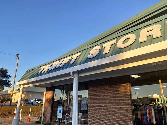 Golden hour lighting bathes this thrift store in warm glow, making even bargain hunting feel like a glamorous evening activity.