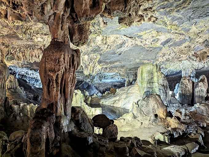 Massive formations rise from the cavern floor while delicate stalactites dangle overhead in this subterranean cathedral of stone.