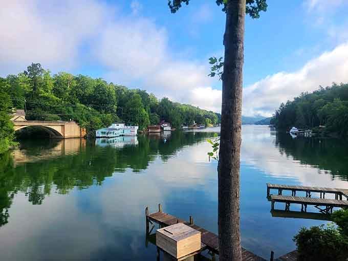Morning calm turns the lake into glass, reflecting houseboats and mountains in perfect symmetry that photographers dream about.
