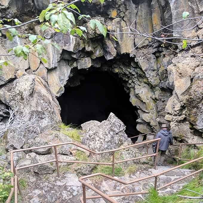 Stone steps descend into darkness at the cave entrance, promising underground adventures straight from Indiana Jones movies.