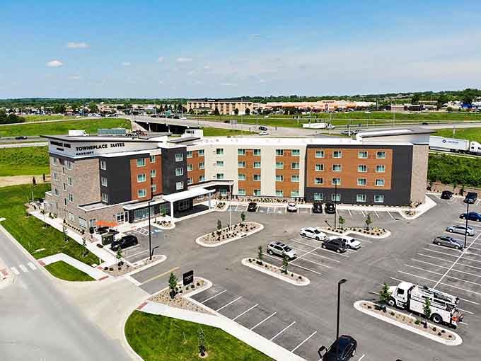 Modern hotels rise from the landscape, offering comfortable accommodations where highways meet hospitality and convenience.
