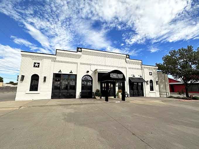 White brick and black trim create a timeless look—like something out of "Giant," but with better air conditioning inside.
