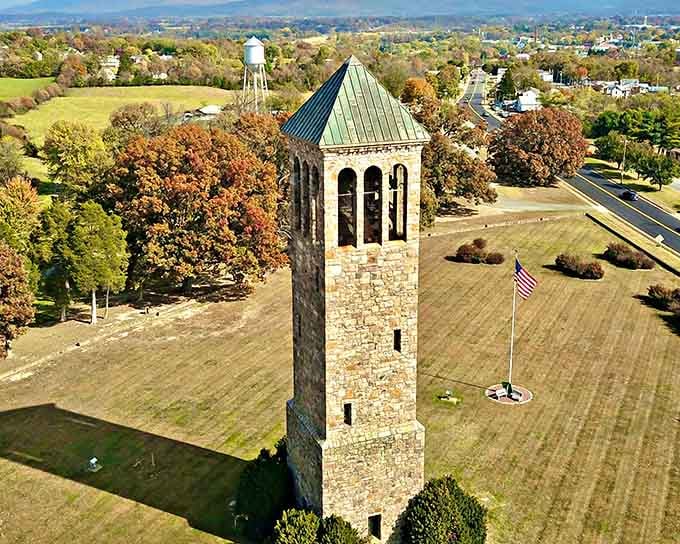 That stone bell tower rises above autumn fields like a sentinel watching over generations of peaceful days.