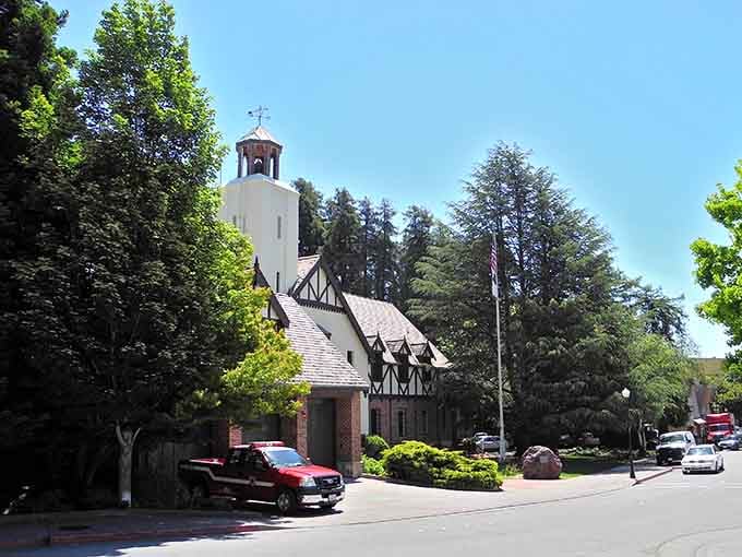 A charming bell tower rises above trees like a friendly lighthouse guiding neighbors home to supper.