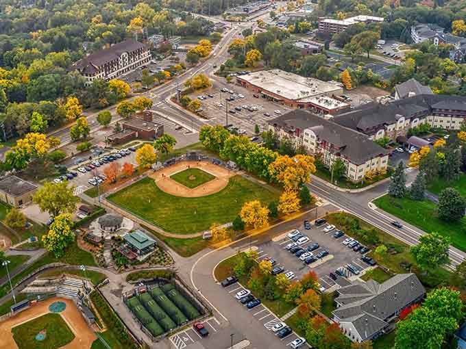 Autumn colors paint the landscape in gold and amber, turning an ordinary baseball field into a Norman Rockwell painting.