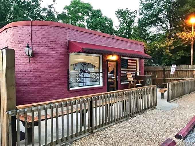 The bold burgundy brick catches evening light like a jewel box holding treasures of tender, juicy steaks.