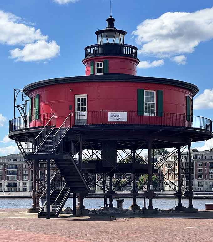 This cherry-red drum rising from black stilts looks like a giant's coffee thermos left behind at the waterfront.