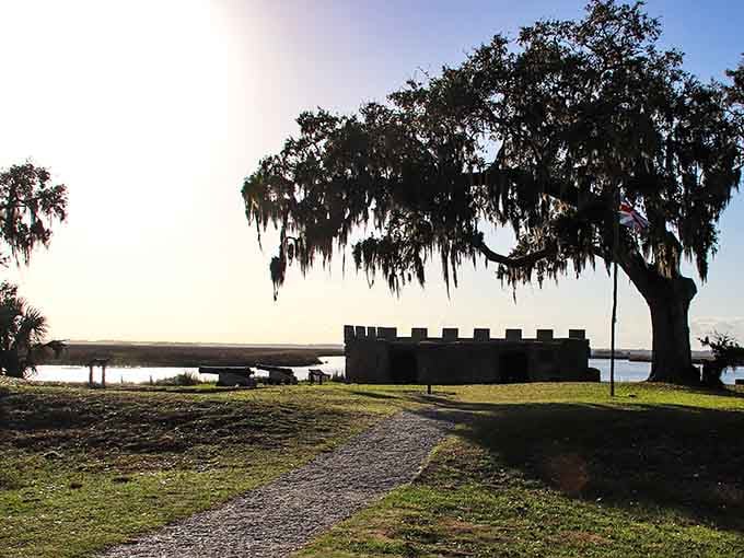 That silhouetted oak and historic fort create a scene so perfectly Southern, you'd swear it was staged for postcards.