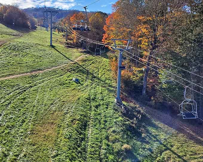 Autumn leaves blazing orange along the chairlift route create that classic Alpine ski resort vibe we all remember.